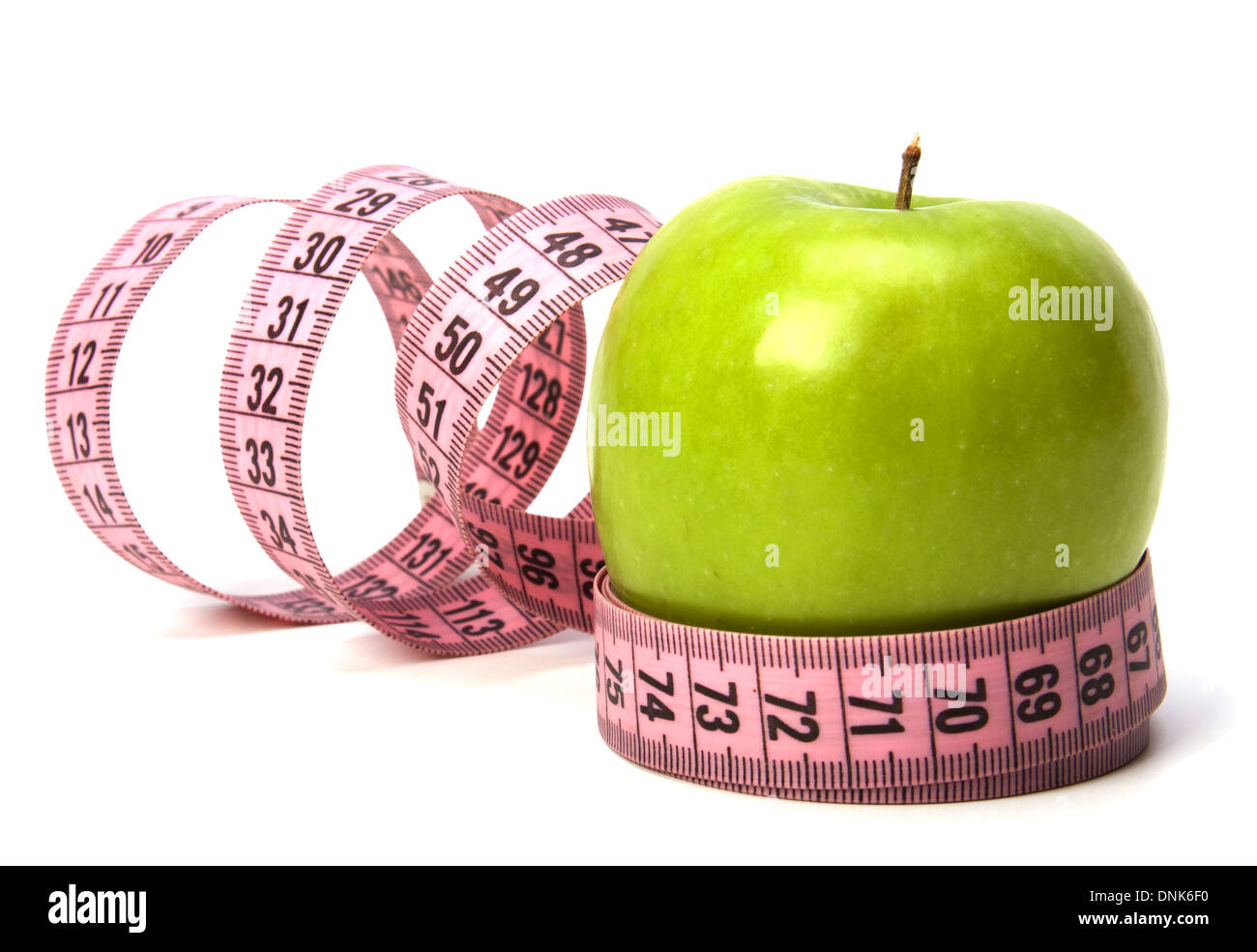 tape measure wrapped around the apple isolated on white background ...