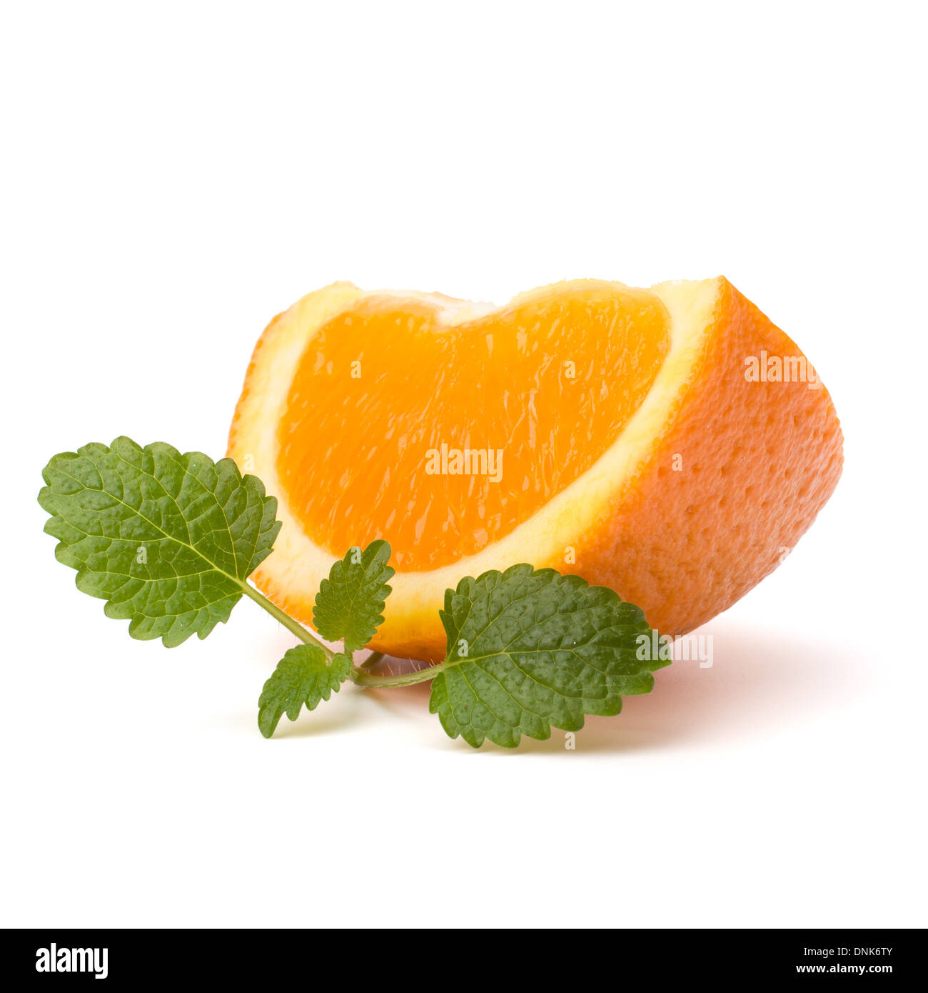 Orange fruit segment and citron mint leaf isolated on white background ...