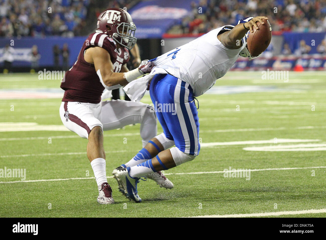 Atlanta, Georgia, USA. 31st December 2013. Duke's Anthony Boone (7 ...