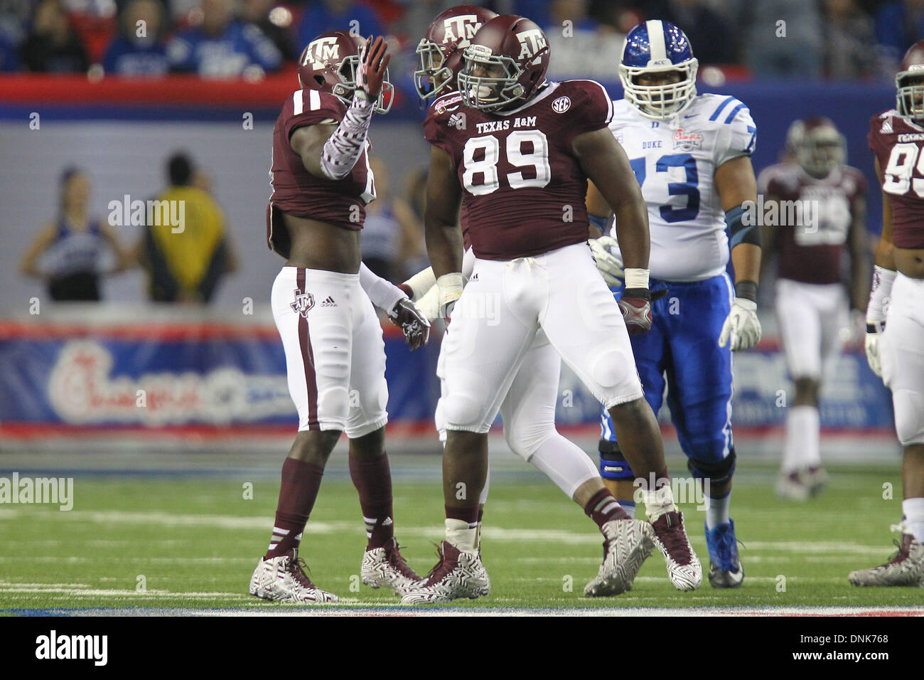 Atlanta, Georgia, USA. 31st December 2013. Texas A&M's Ivan Robinson ...