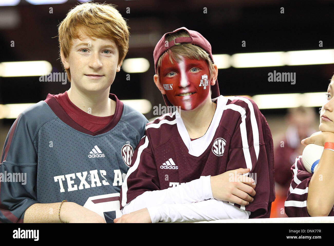 Atlanta, Georgia, USA. 31st December 2013. A couple of young Aggie fans ...