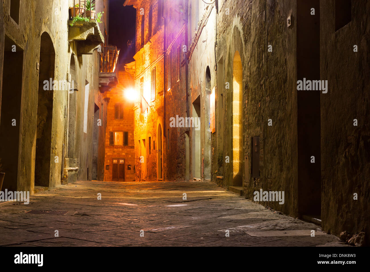 mysterious narrow alley with lanterns at night Stock Photo - Alamy