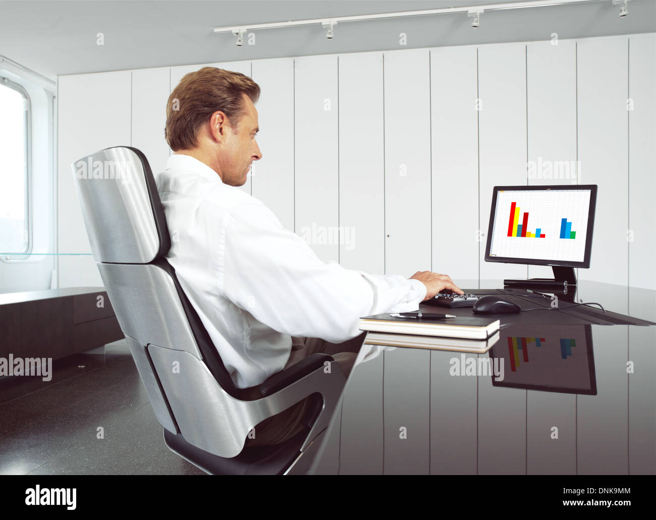 Boss types document in office Stock Photo - Alamy