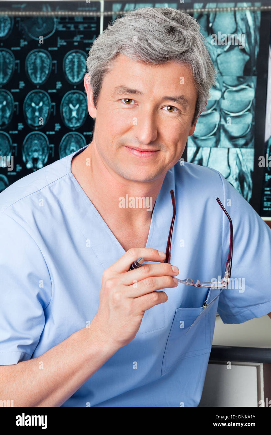 Doctor Holding Glasses Stock Photo - Alamy