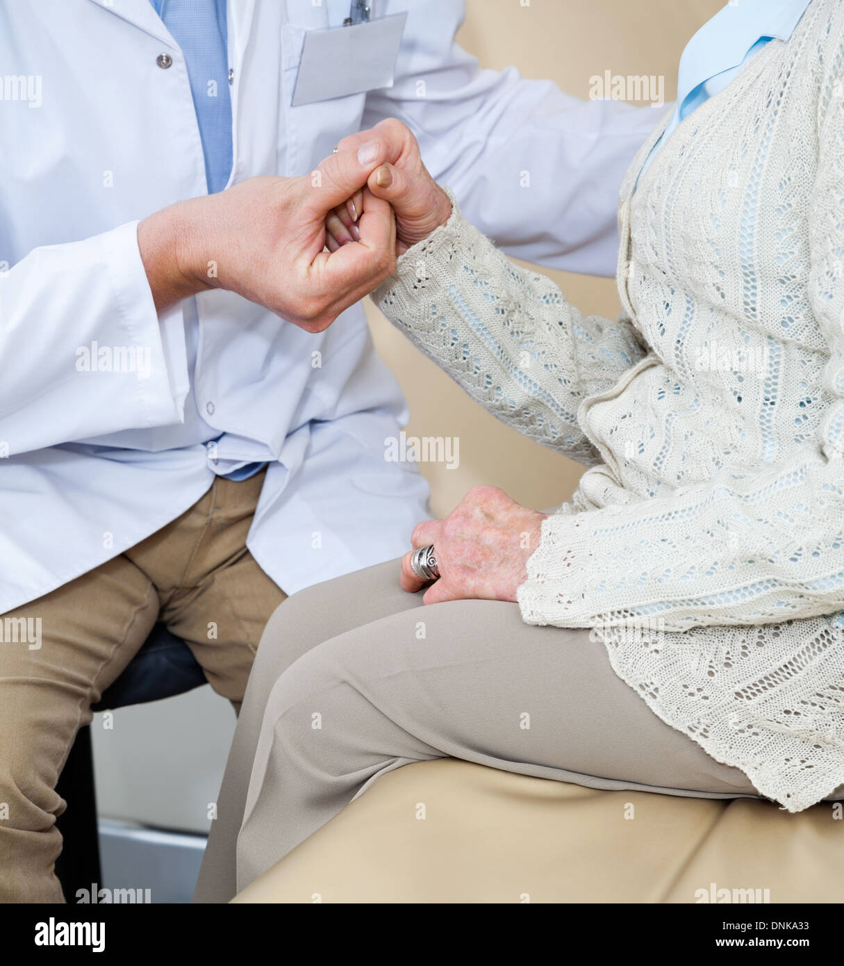 Doctor Comforting Female Patient Stock Photo - Alamy