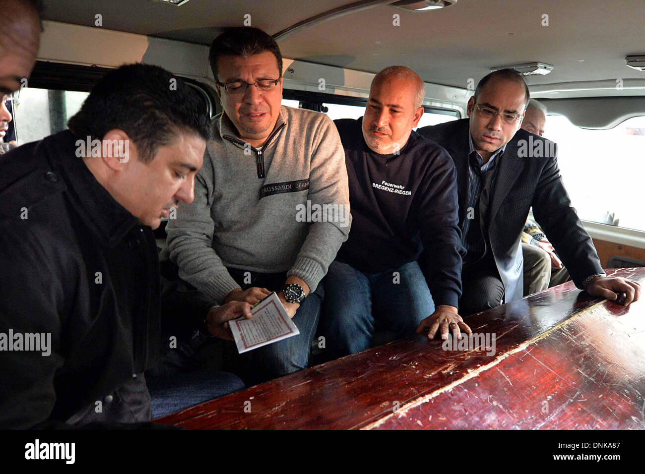 Cairo, Cairo, Egypt. 1st Jan, 2014. Egyptian mourners pray over the ...