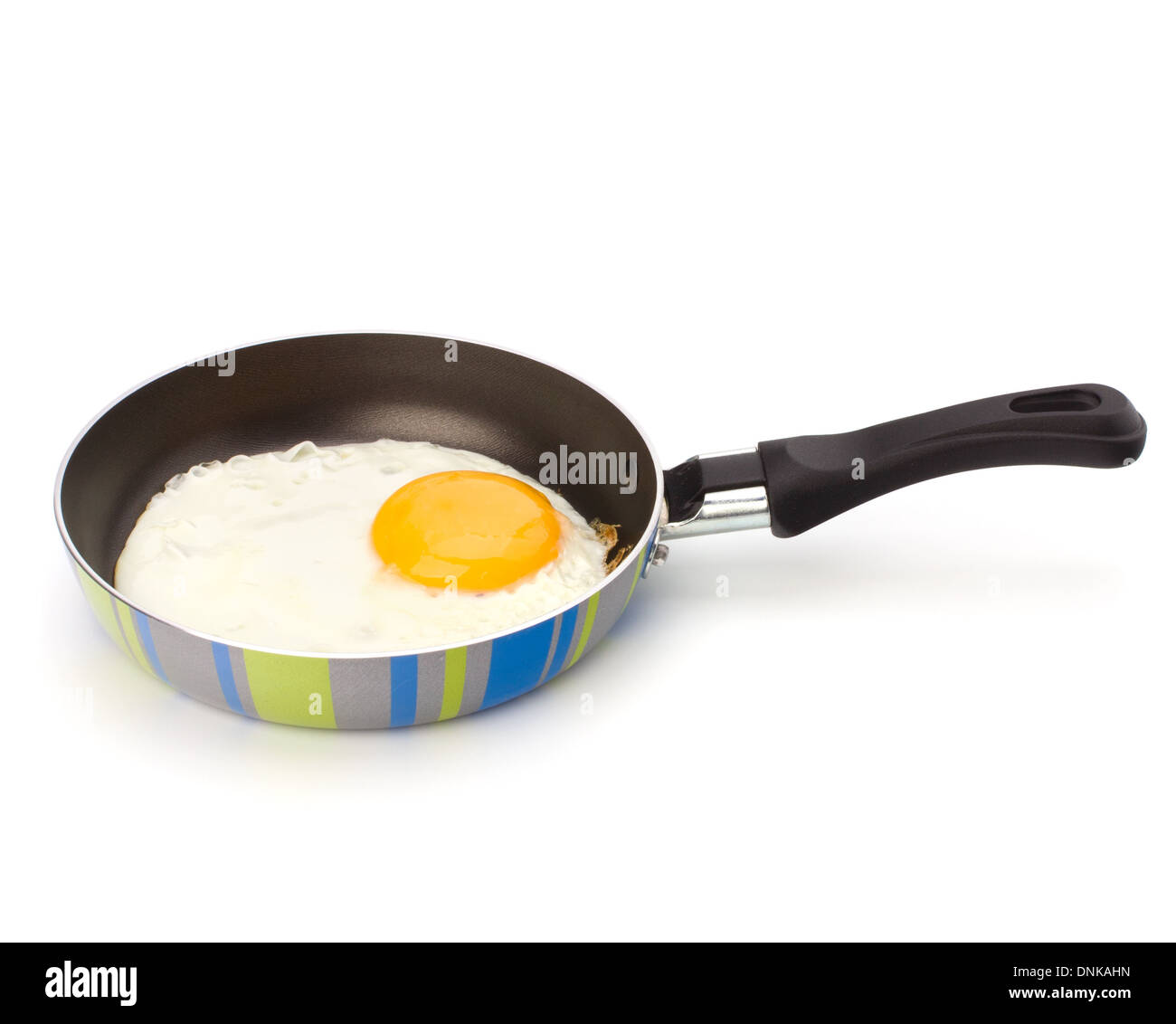 Fried egg on pan over white background Stock Photo - Alamy