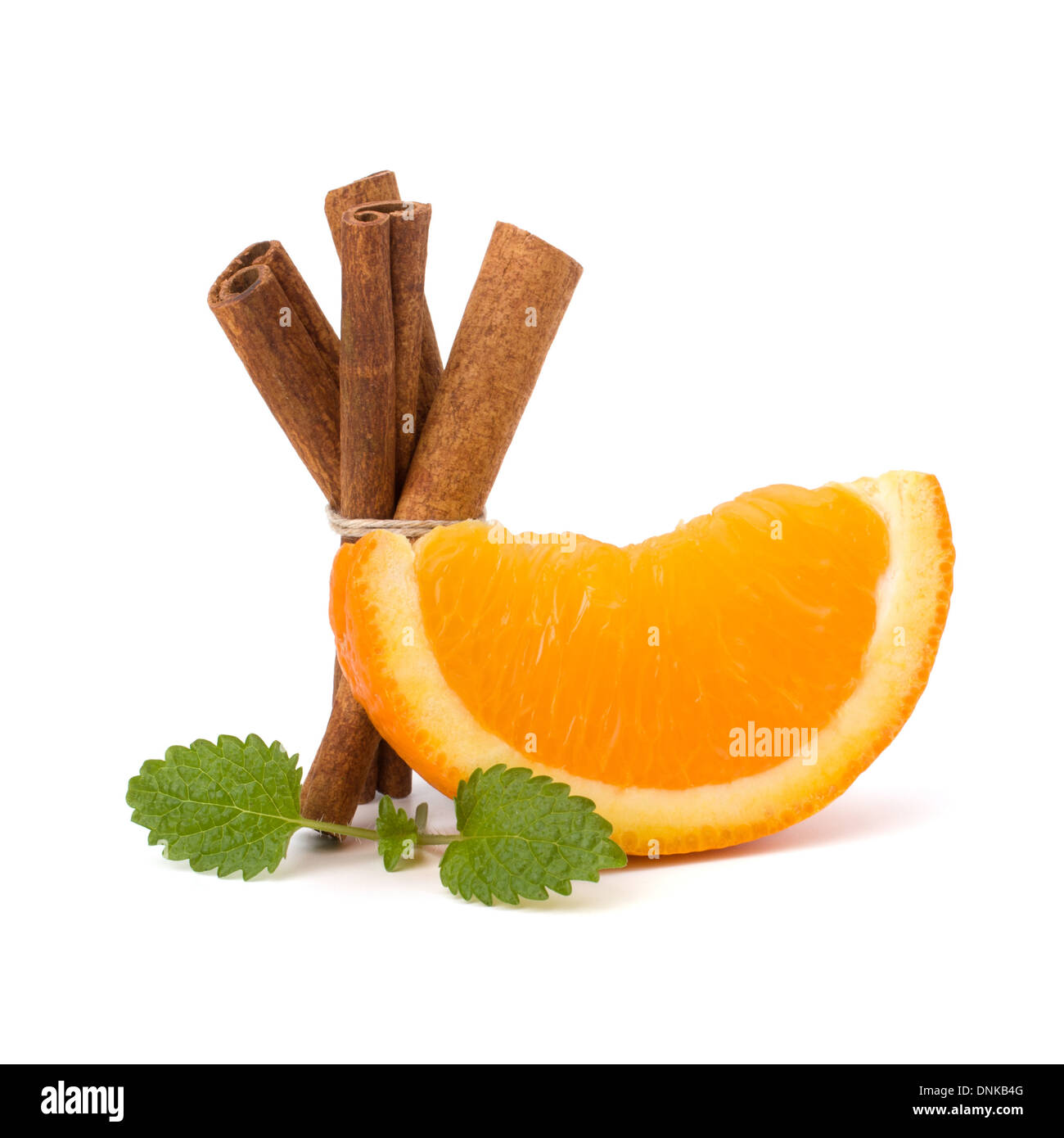 Orange fruit segment, cinnamon sticks and mint isolated on white ...