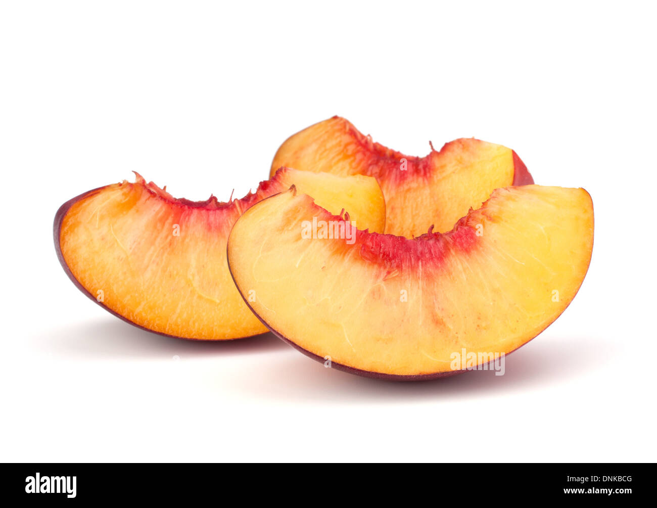 Nectarine fruit segments isolated on white background Stock Photo - Alamy