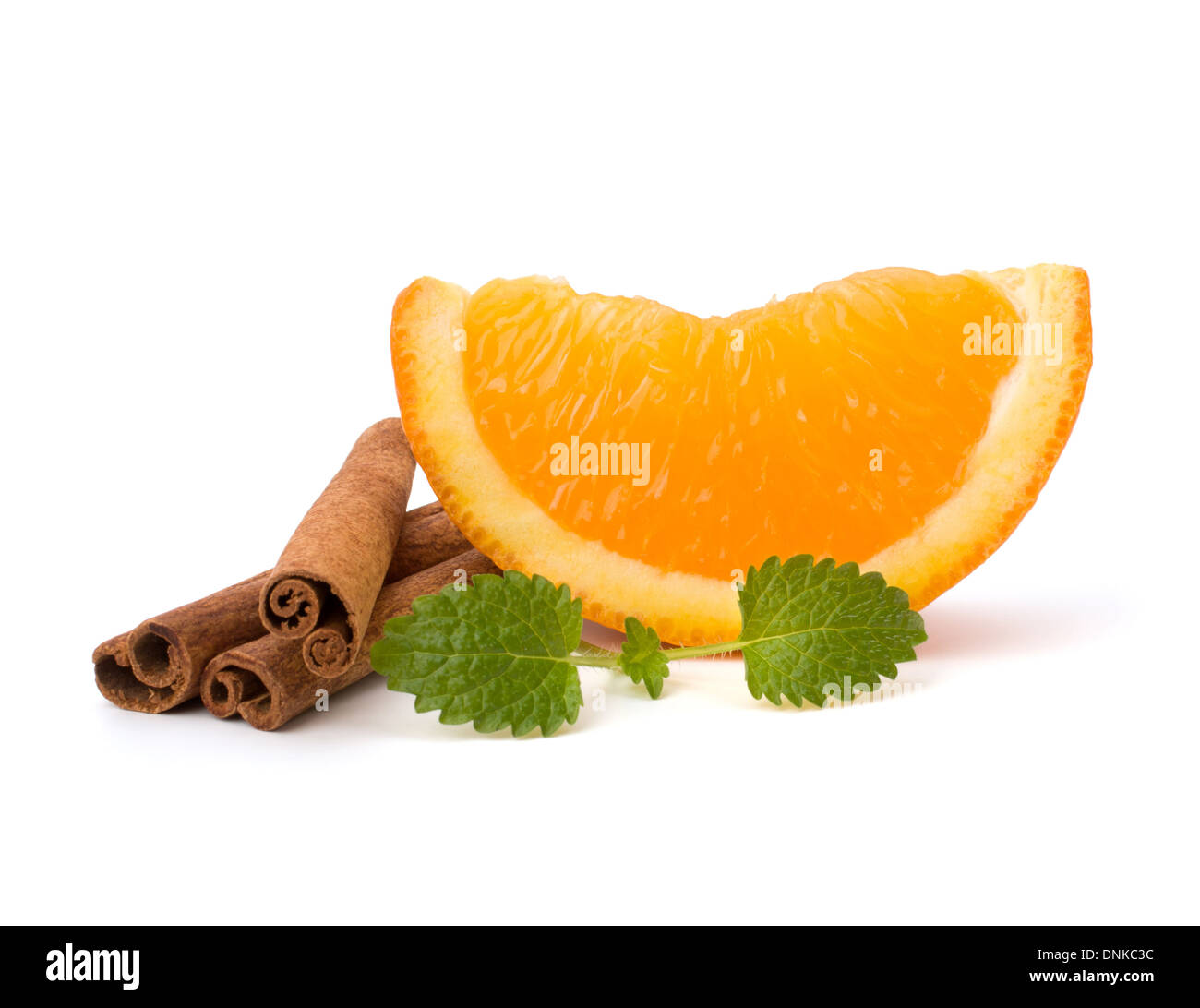 Orange fruit segment, cinnamon sticks and mint isolated on white ...