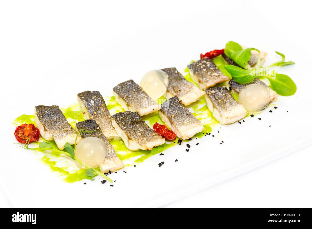 baked black cod fish on a white background in the restaurant Stock ...