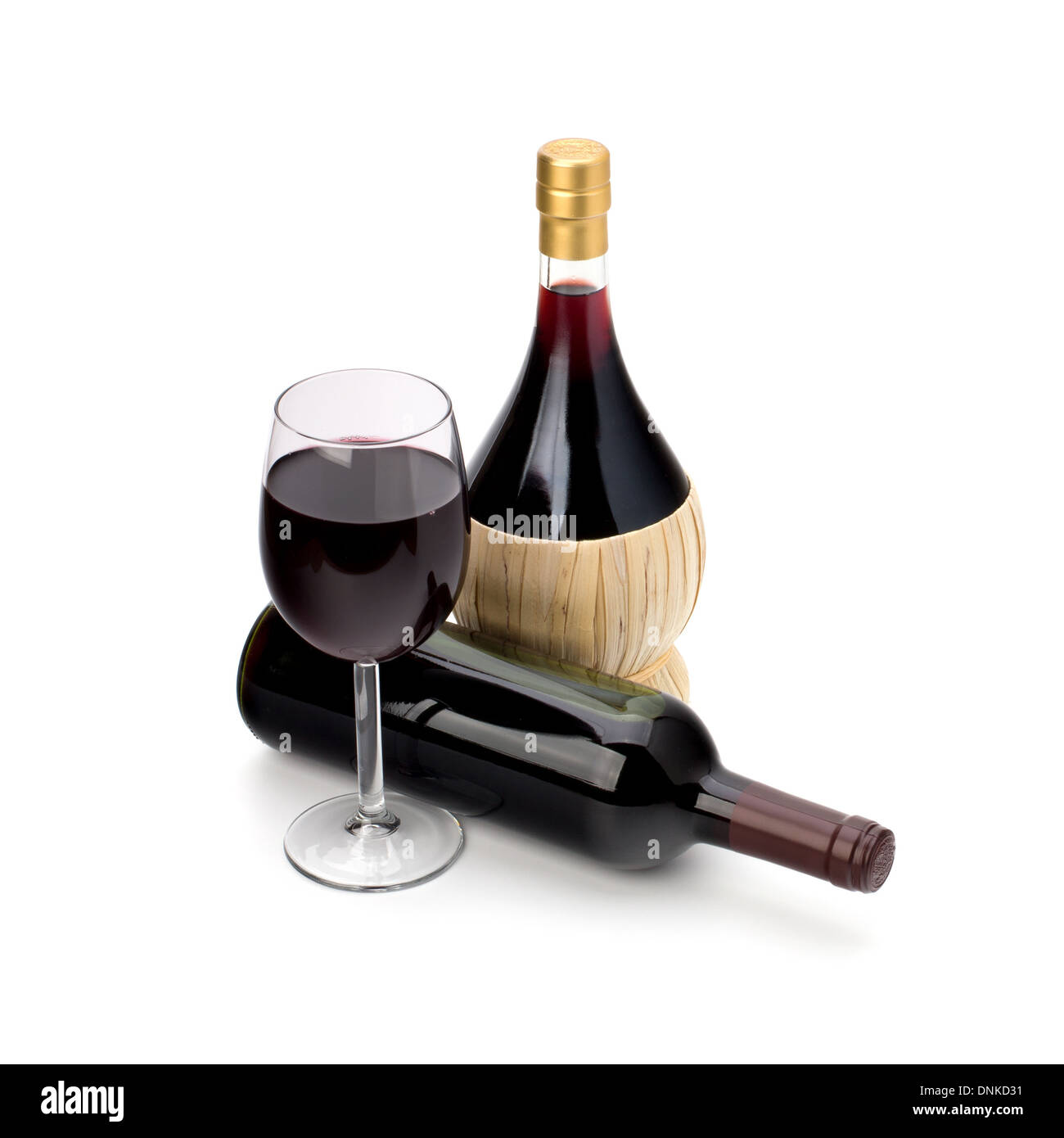 Full red wine glass goblet and bottle isolated on white background ...
