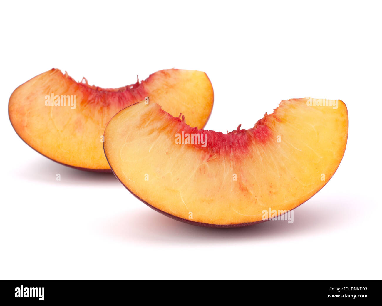 Nectarine fruit segments isolated on white background Stock Photo - Alamy
