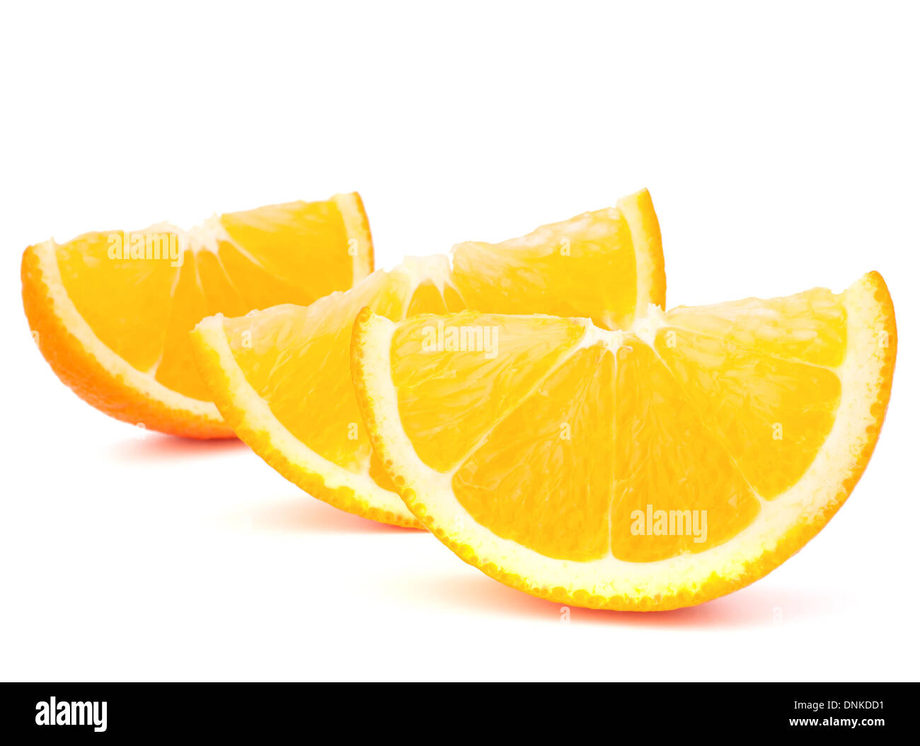 Three orange fruit segments or cantles isolated on white background ...