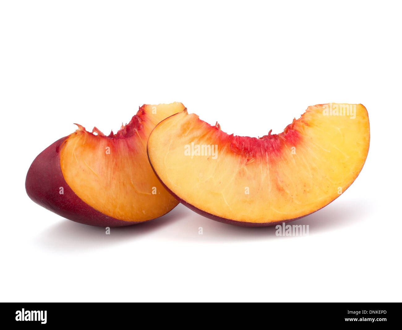 Nectarine fruit segments isolated on white background Stock Photo - Alamy