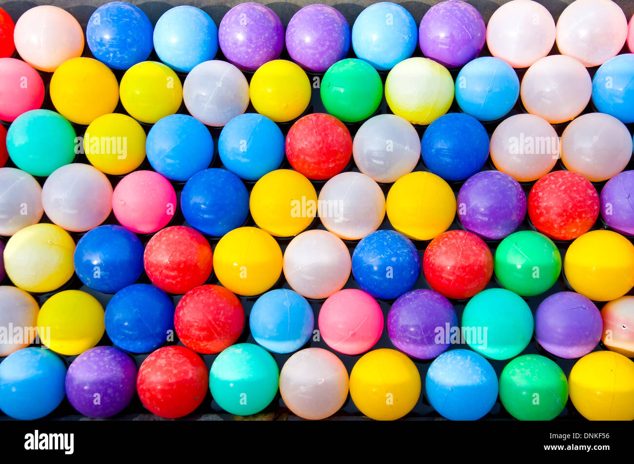 colorful of small ball in water Stock Photo - Alamy
