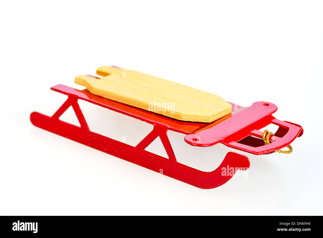 Red miniature sled toy Stock Photo - Alamy