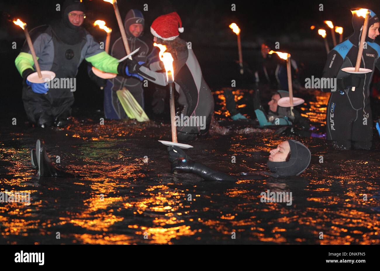 Fuessen, Germany. 01st Jan, 2014. Participants of the traditional torch ...