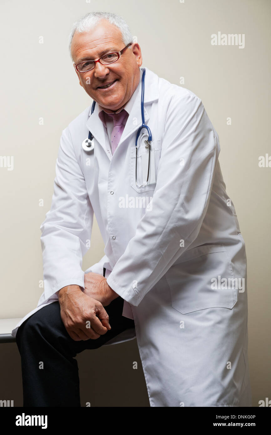 Professional doctor sitting desk hi-res stock photography and images ...