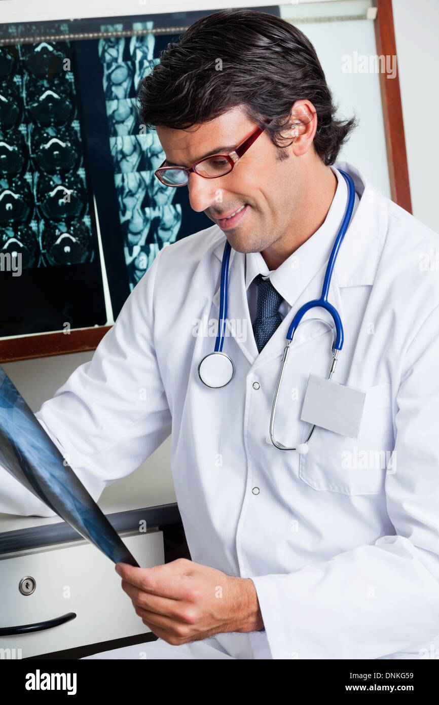 Male Radiologist Reviewing X-ray Stock Photo - Alamy