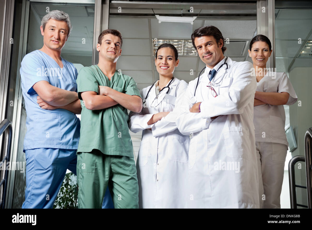 Medical Professionals Standing With Hands Folded Stock Photo - Alamy