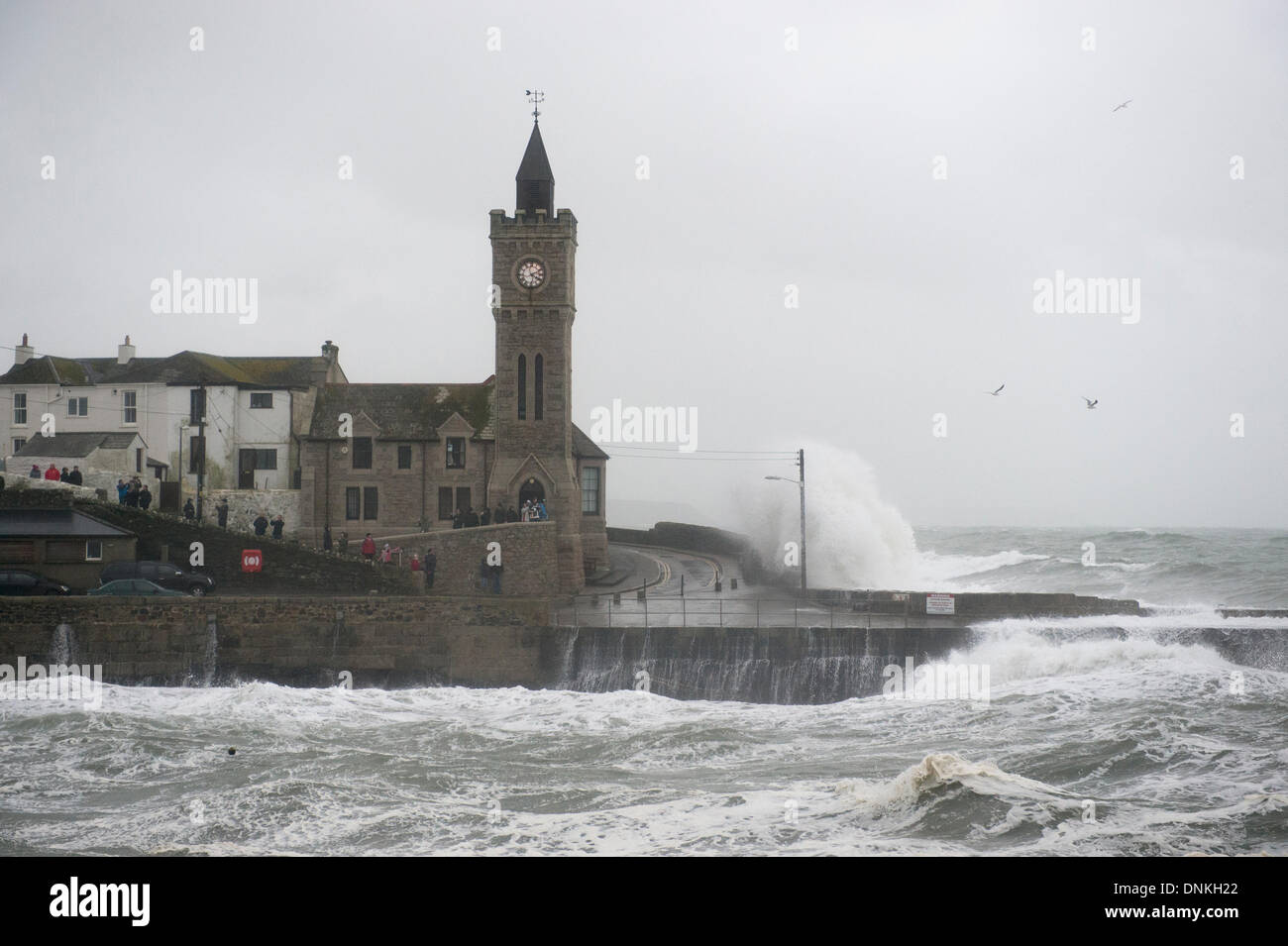 Massive waves crash into Porthleven during a winter storm, into the ...