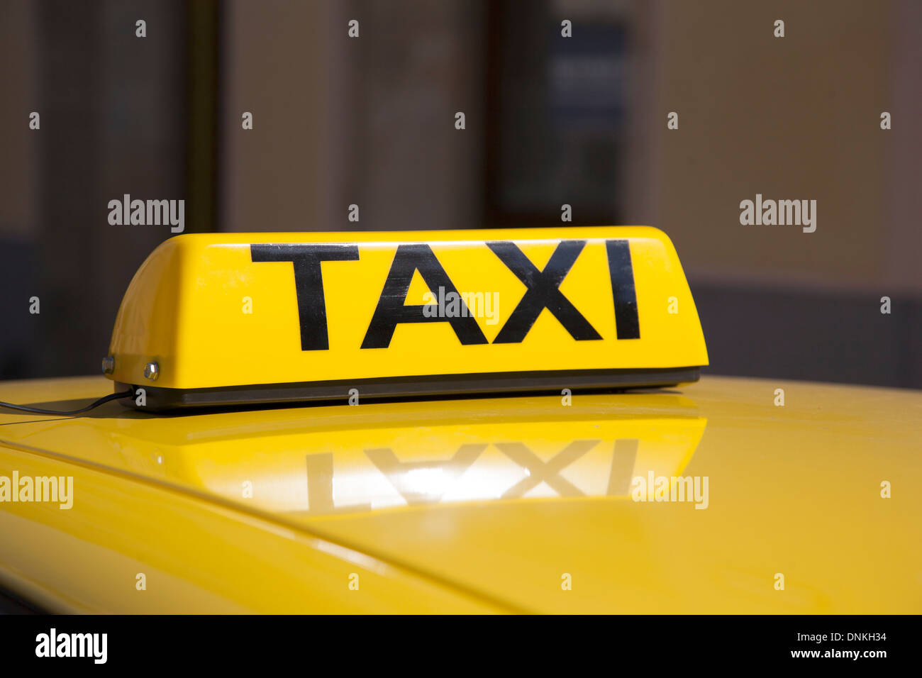 Yellow Taxi Sign on Top of Car Stock Photo - Alamy