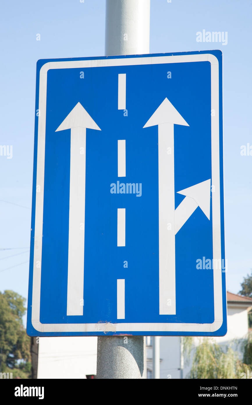 Blue Arrow Traffic Direction Sign on Blue Sky Background Stock Photo ...