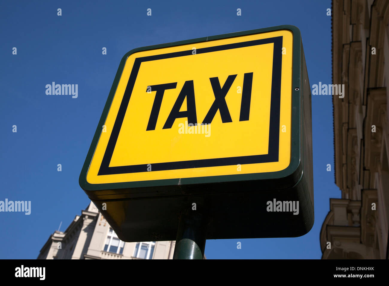Yellow Taxi Sign against Blue Sky Background Stock Photo - Alamy