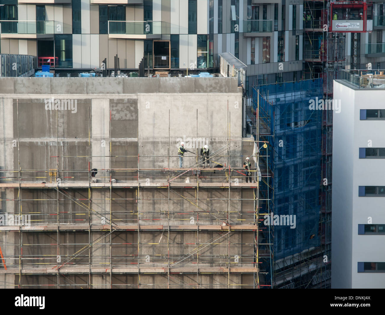 Workmen on the Saffron Square development in central Croydon, London ...