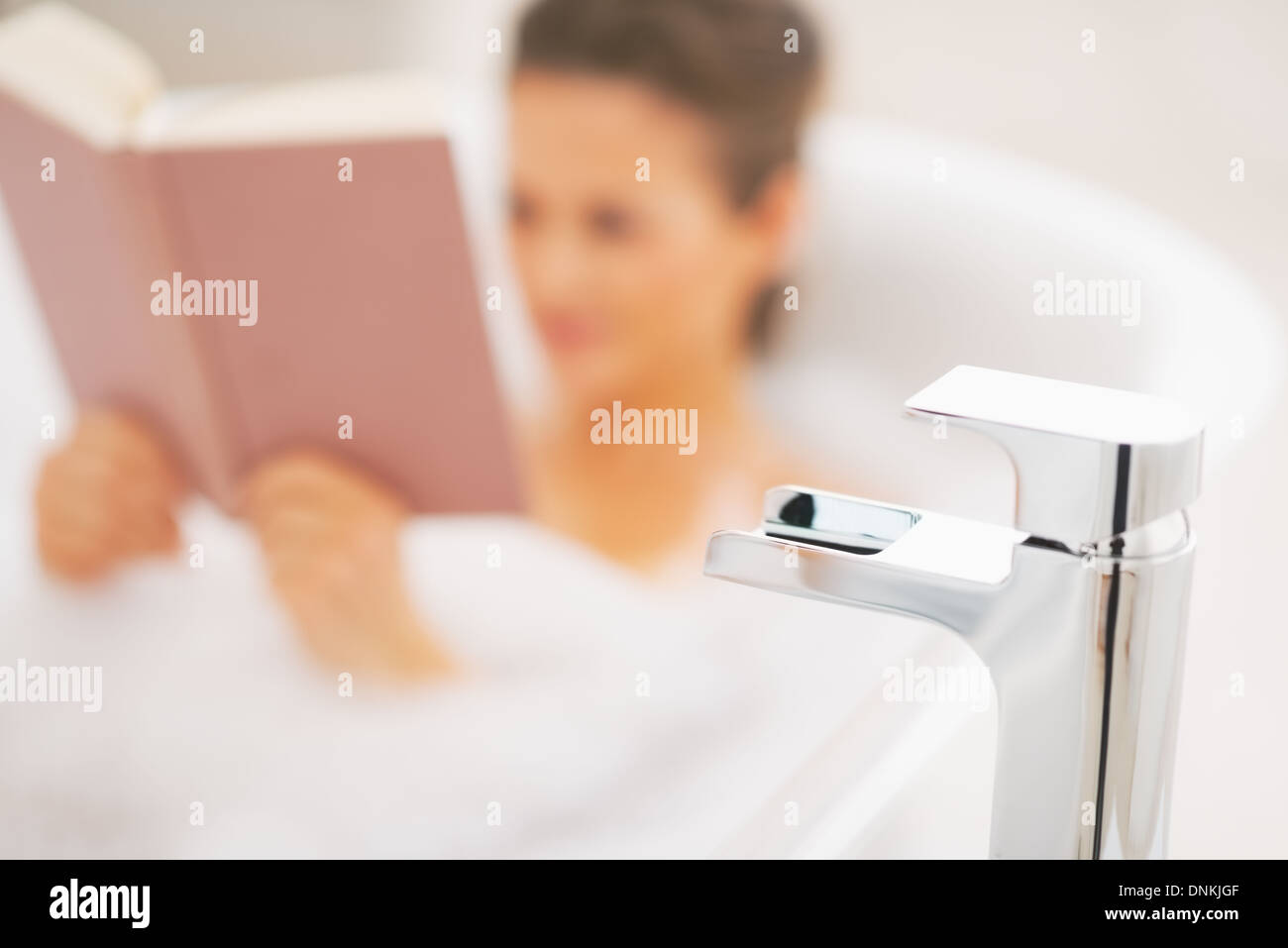 Woman reading in bath hi-res stock photography and images - Alamy