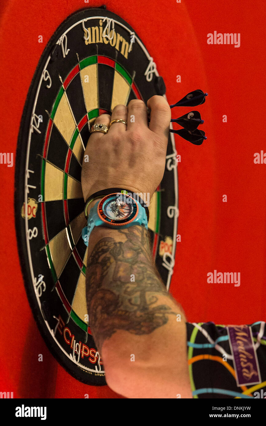 London, UK. 01st Jan, 2014. A detail shot of Peter WRIGHT collecting ...