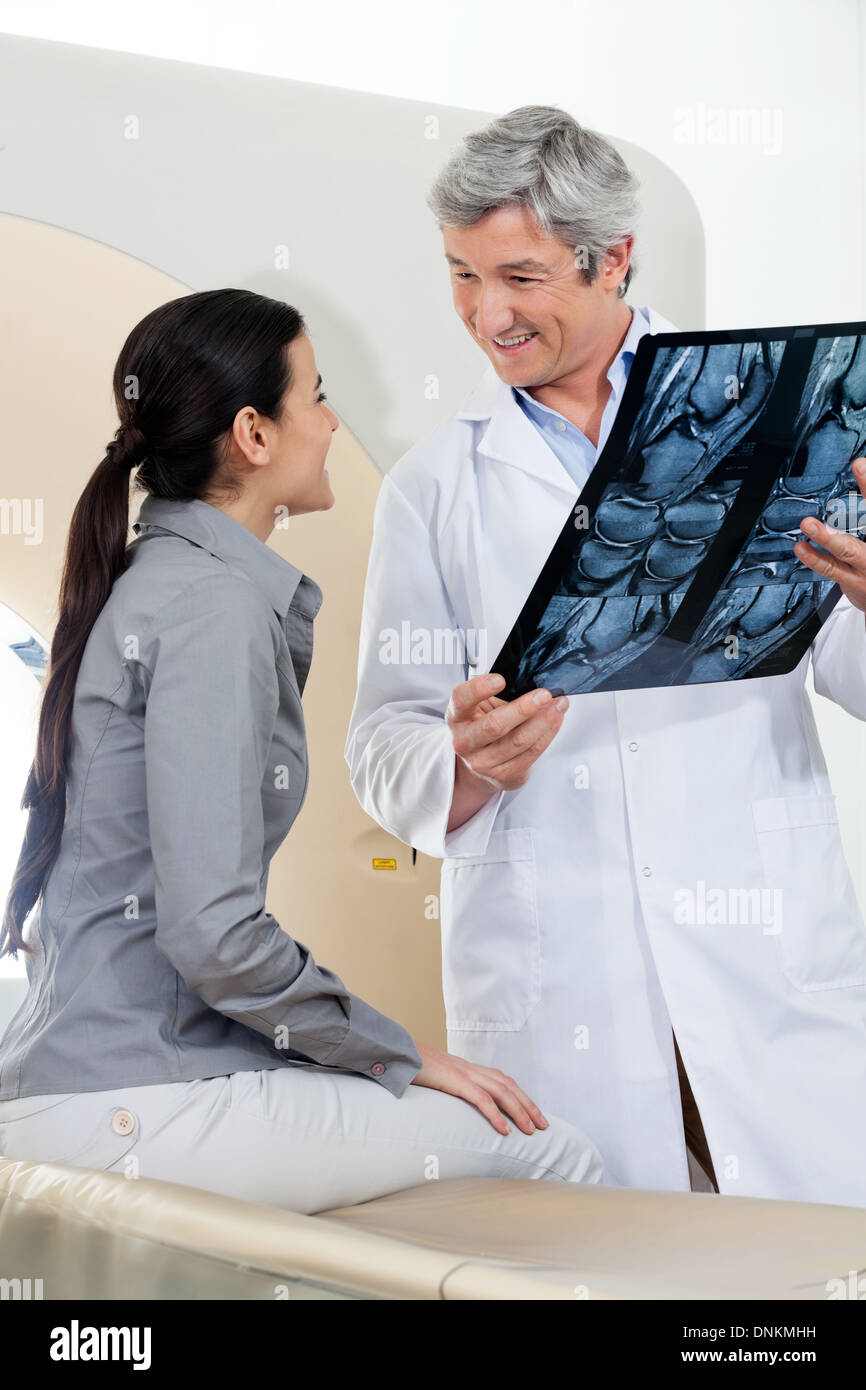 Radiologist Looking At Female Patient Stock Photo - Alamy