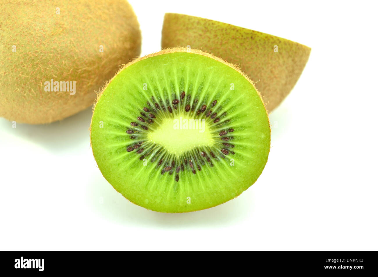 Whole kiwi fruit and his sliced segments isolated on white background ...