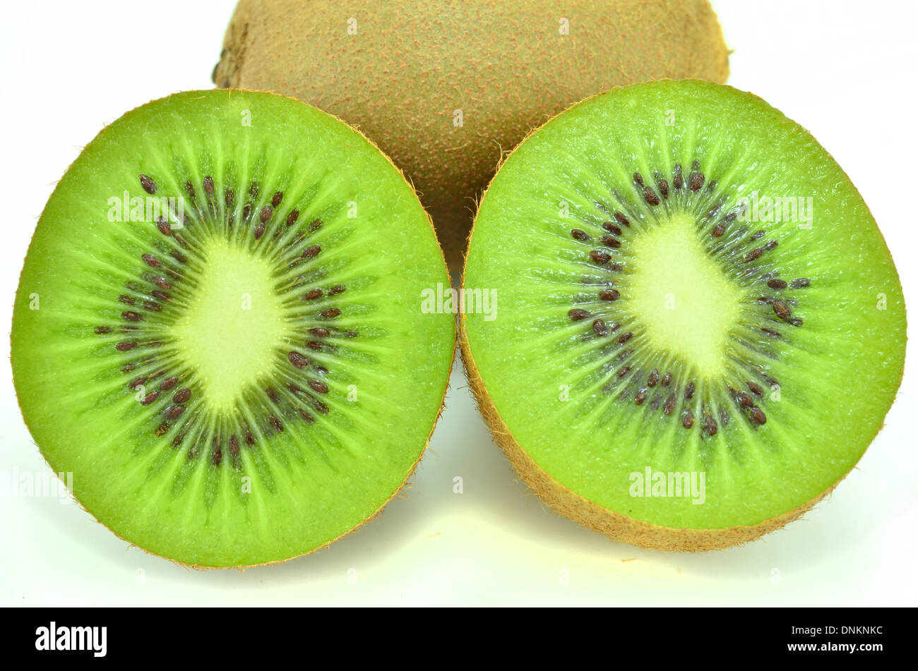 Whole kiwi fruit and his sliced segments isolated on white background ...