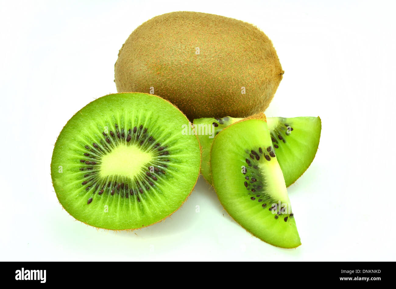 Whole kiwi fruit and his sliced segments isolated on white background ...