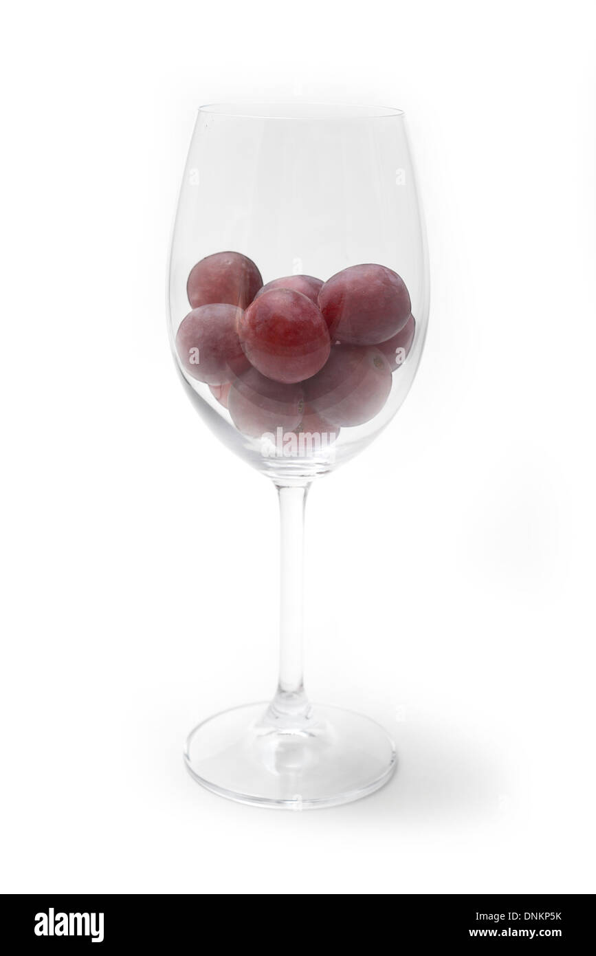 Cup full of grapes on white background Stock Photo - Alamy