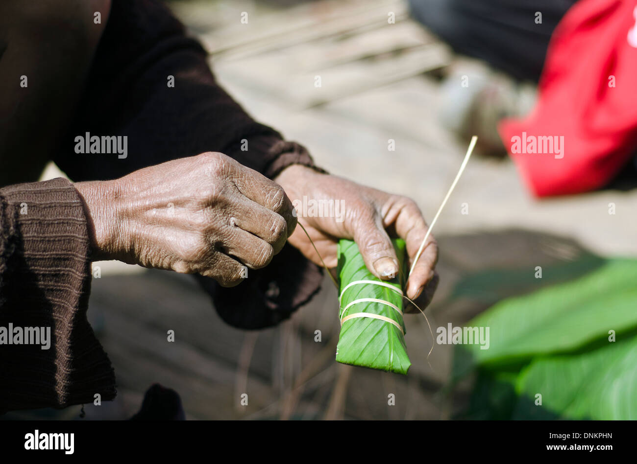 Akha woman makes rice cake , Muang Sing area, Northen Laos Stock Photo ...