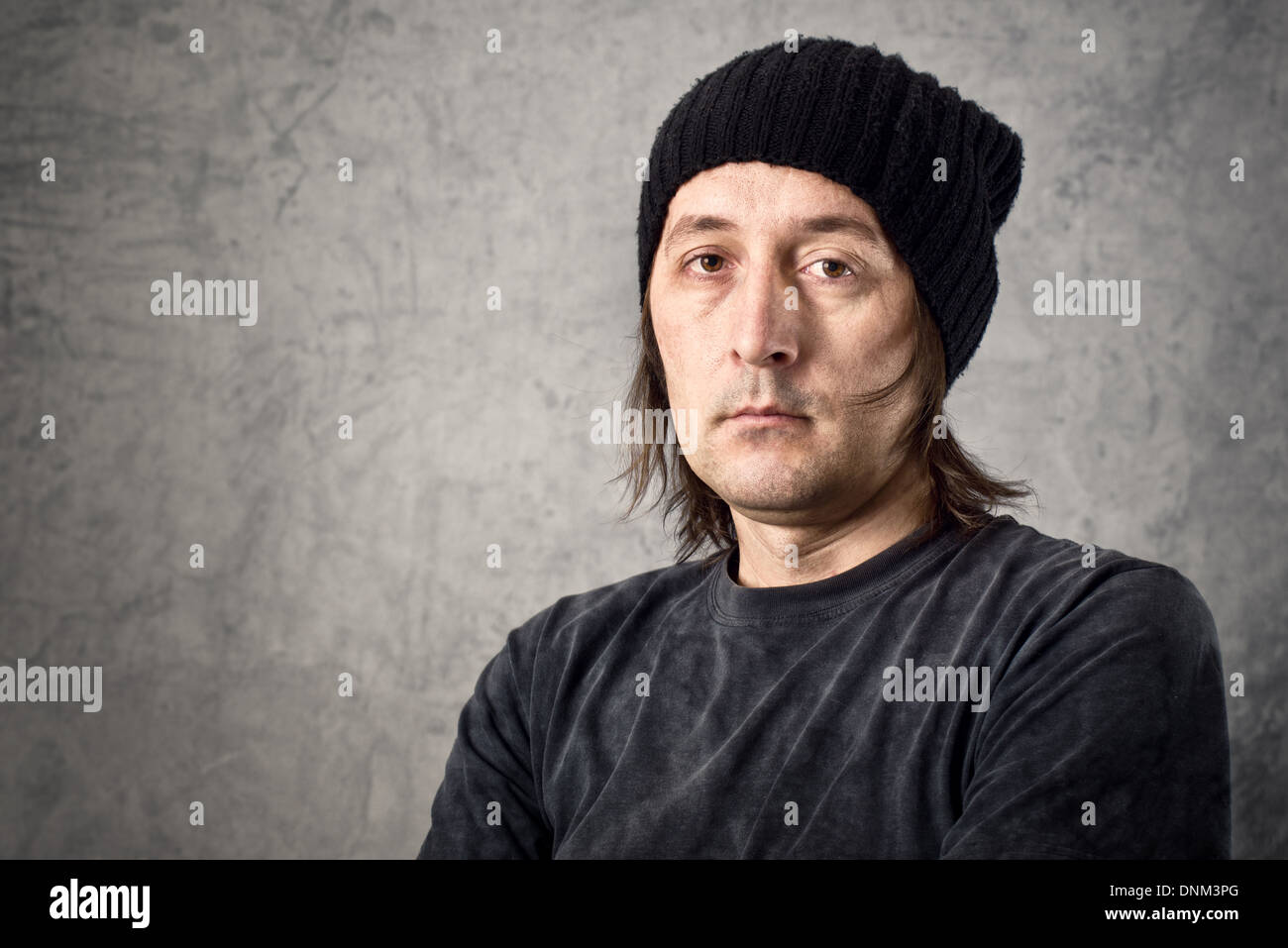Portrait of Casual Man with Black Cap against grunge background Stock ...