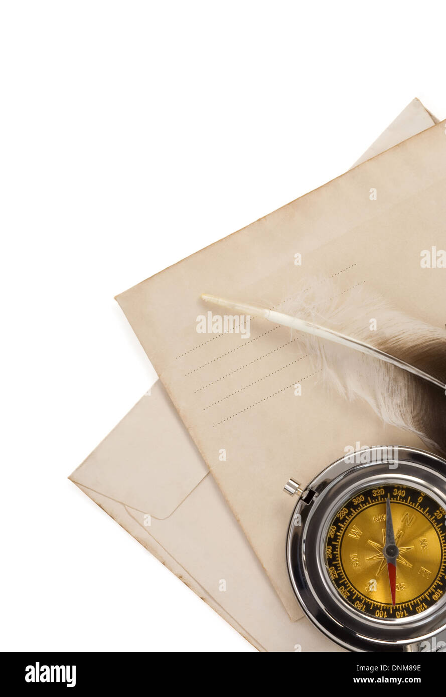 ink pen and compass at vintage envelope isolated on white background ...
