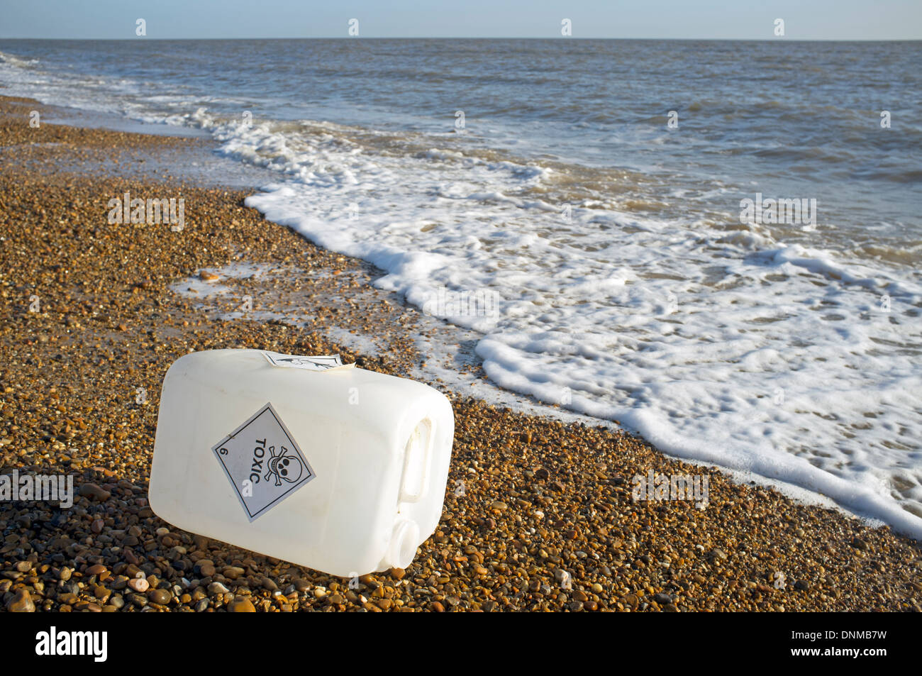 Toxic waste container washed up on beach Stock Photo - Alamy