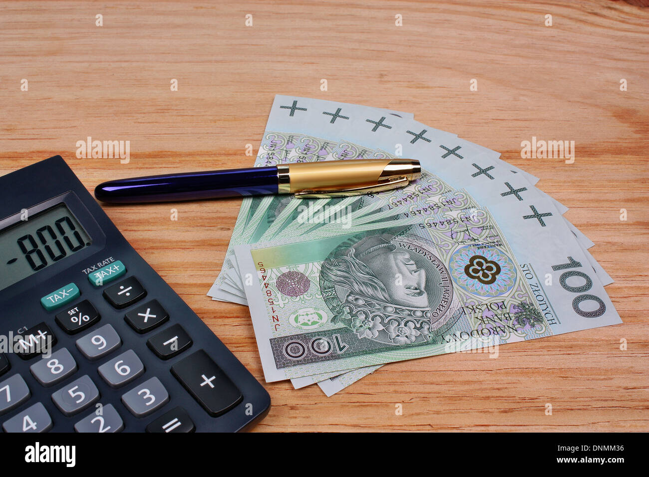 Polish money calculator pen on the table Stock Photo - Alamy
