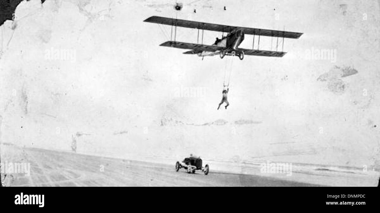 A daring stunt from the 1920s, where a daredevil attempts to transfer ...