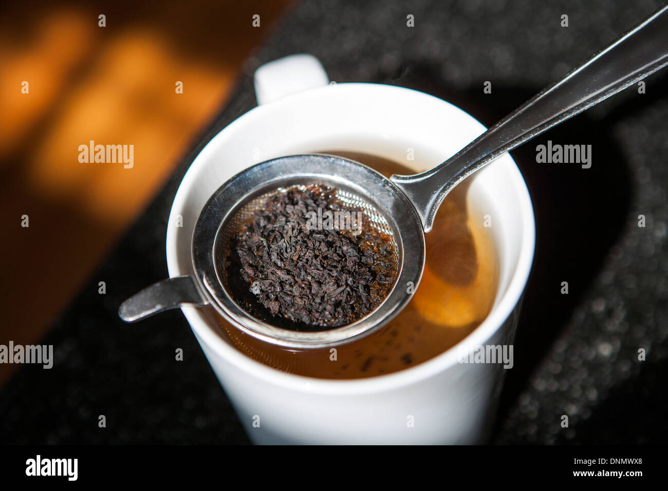 Brewing Loose Tea in Cup Stock Photo - Alamy