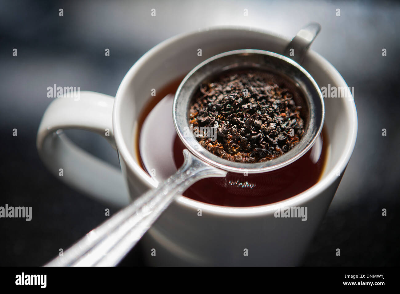 Brewing Loose Tea in Cup Stock Photo - Alamy