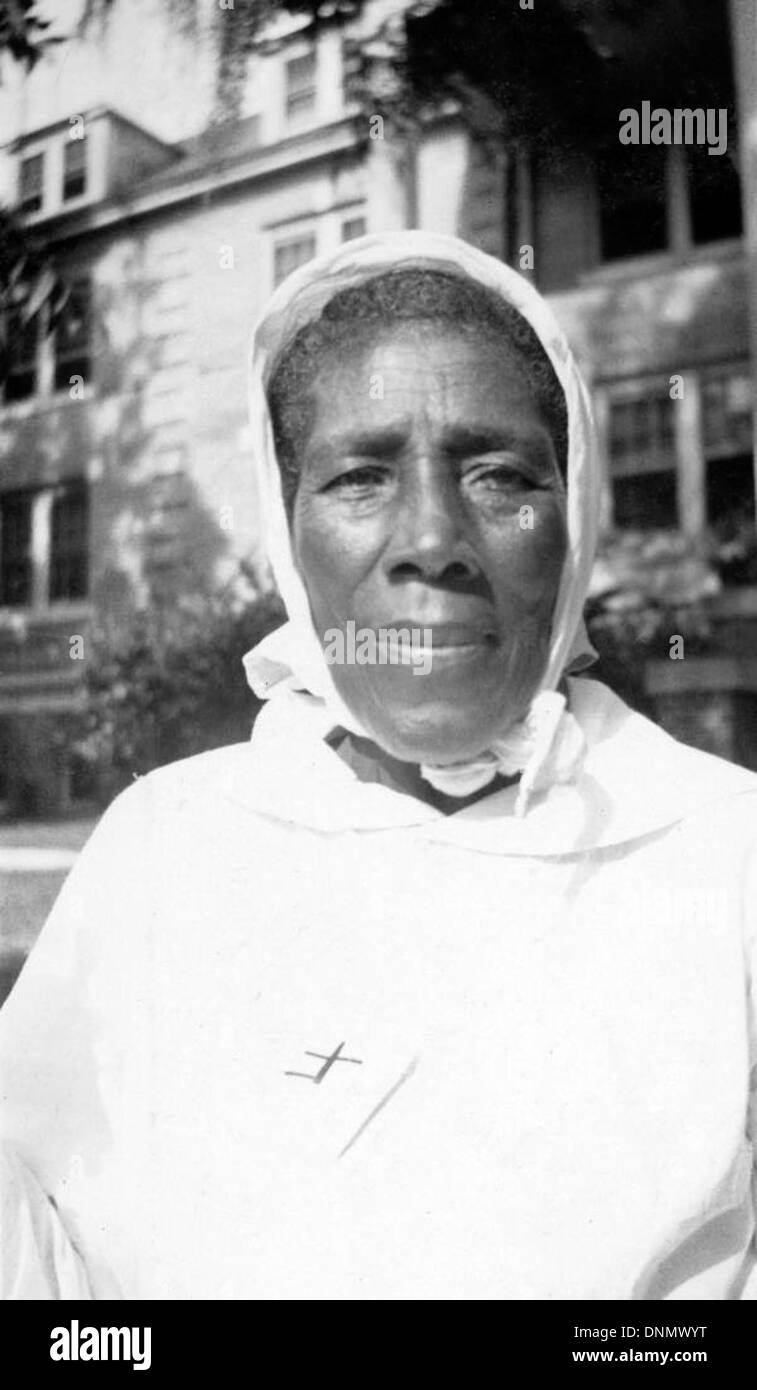 A portrait of a midwife from the early 20th century, highlighting the ...