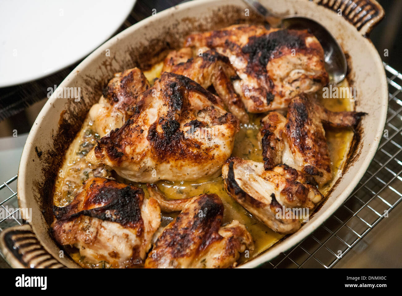 Oven Roasted Chicken in Pan, High Angle View Stock Photo - Alamy