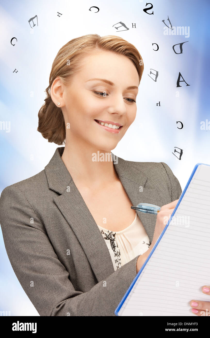 happy woman with big notepad Stock Photo - Alamy