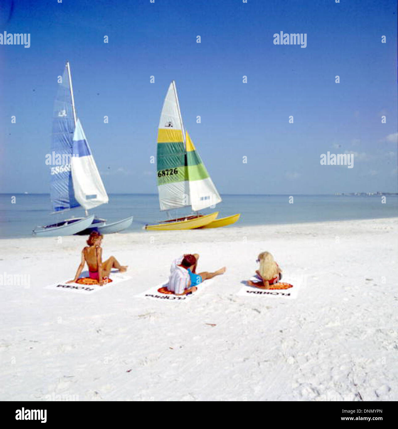 Sunbathers and catamarans at Fort Myers Beach, Florida, in the 1980s ...
