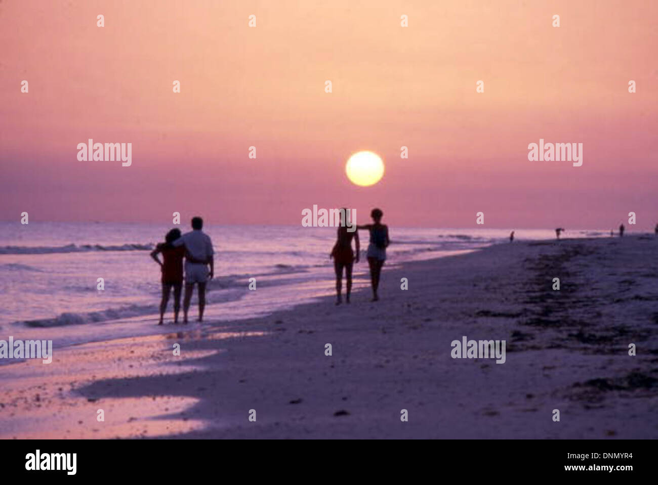 Couples enjoy a sunset on the beach at Captiva Island, Florida, in the ...